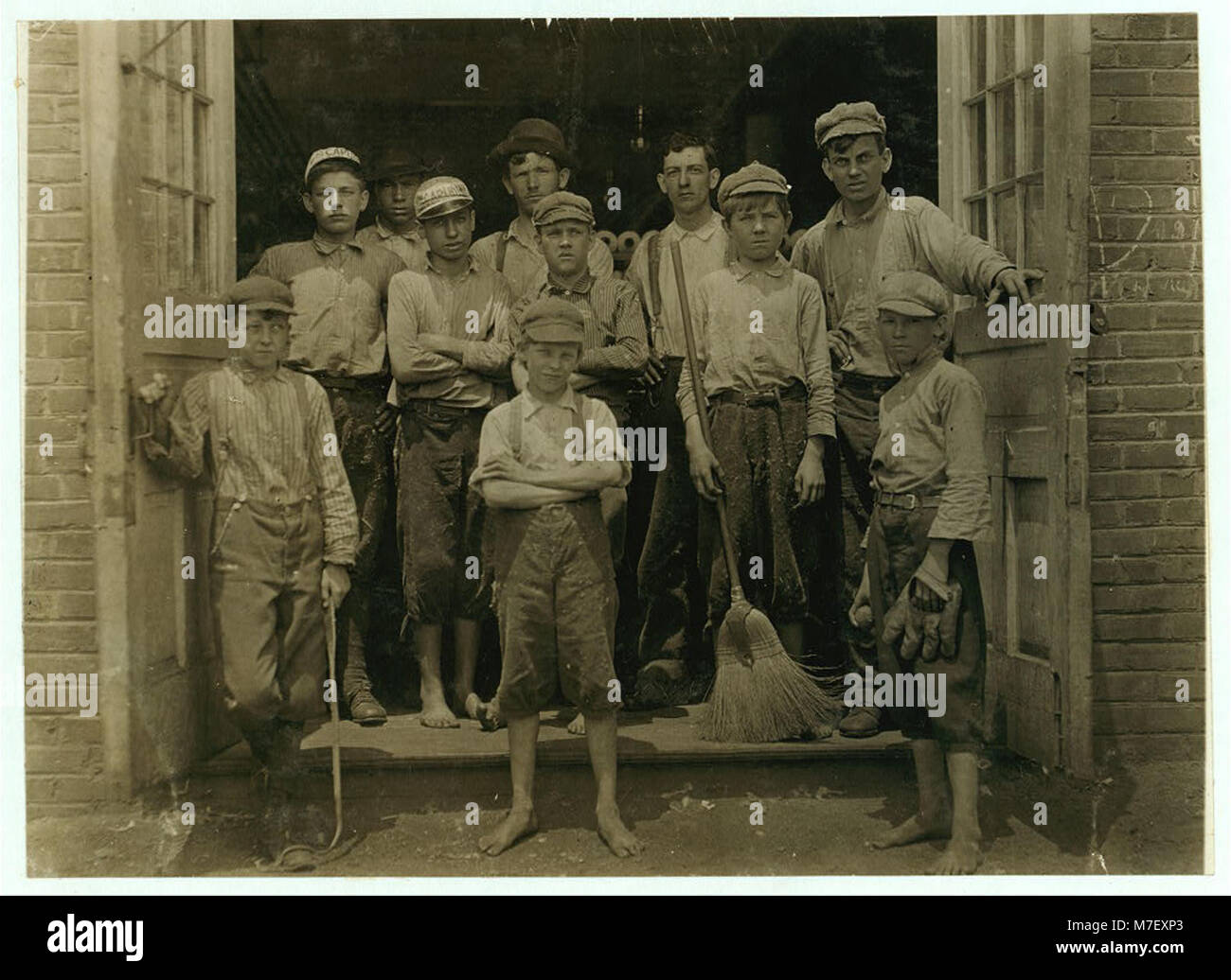 Boys working at the Saxon Mill, likely in an industrial setting ...