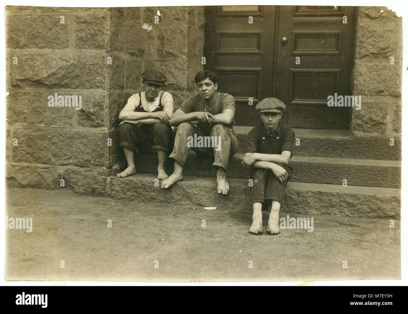 The photograph captures workers at the Granite Mill, demonstrating the ...