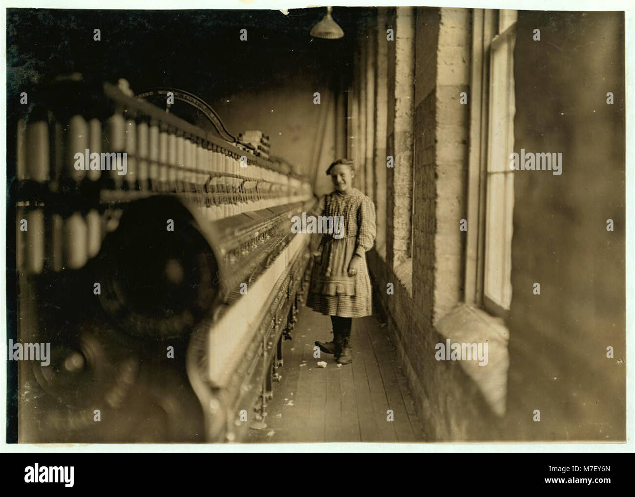 A worker operates a spinner at the Daniels Manufacturing Company in ...