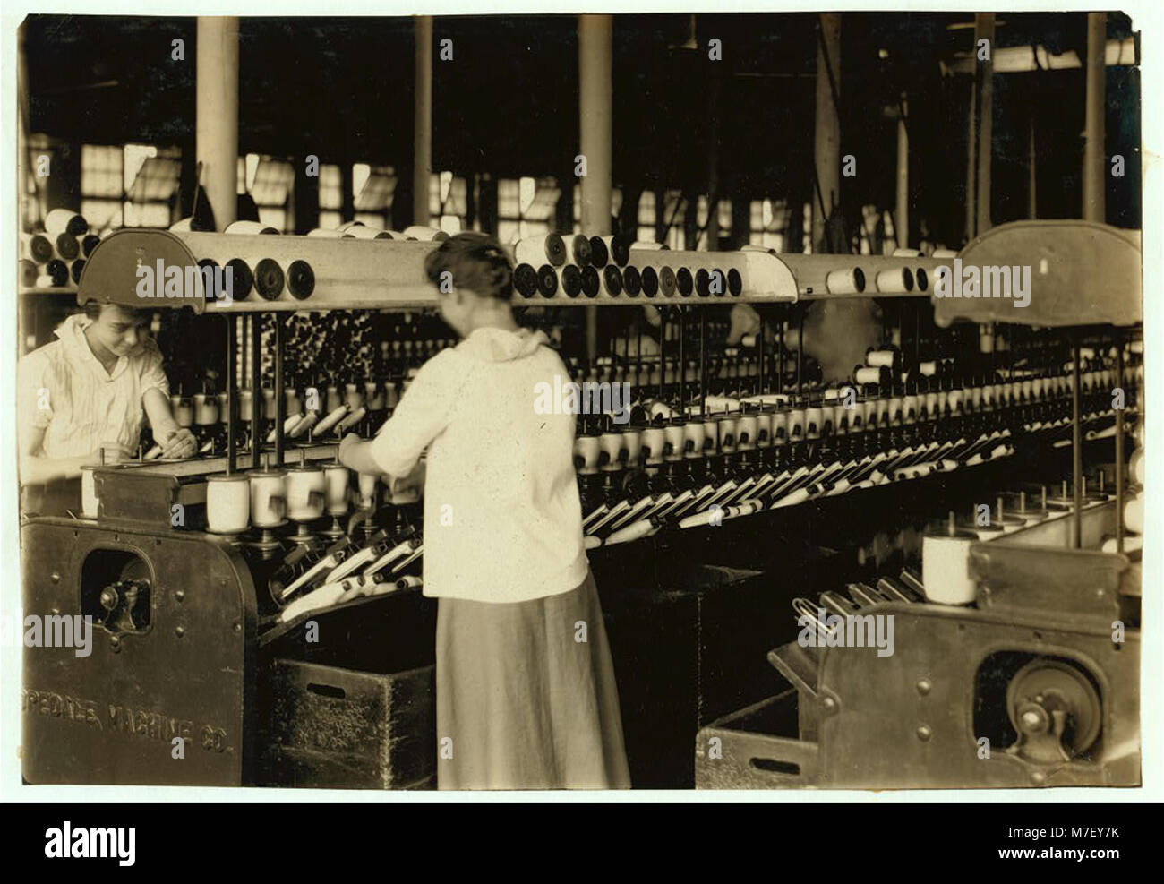 This photo depicts a young spooler tender at the Berkshire Cotton Mills ...