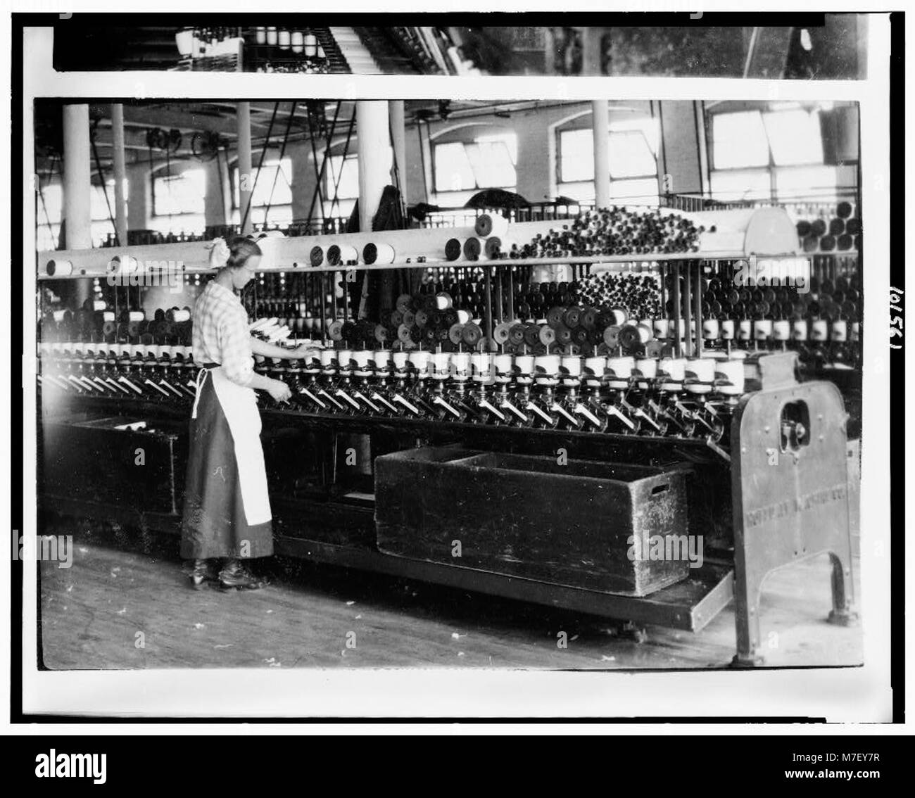 A 15-year-old spooler tender at Berkshire Cotton Mills, captured in a ...