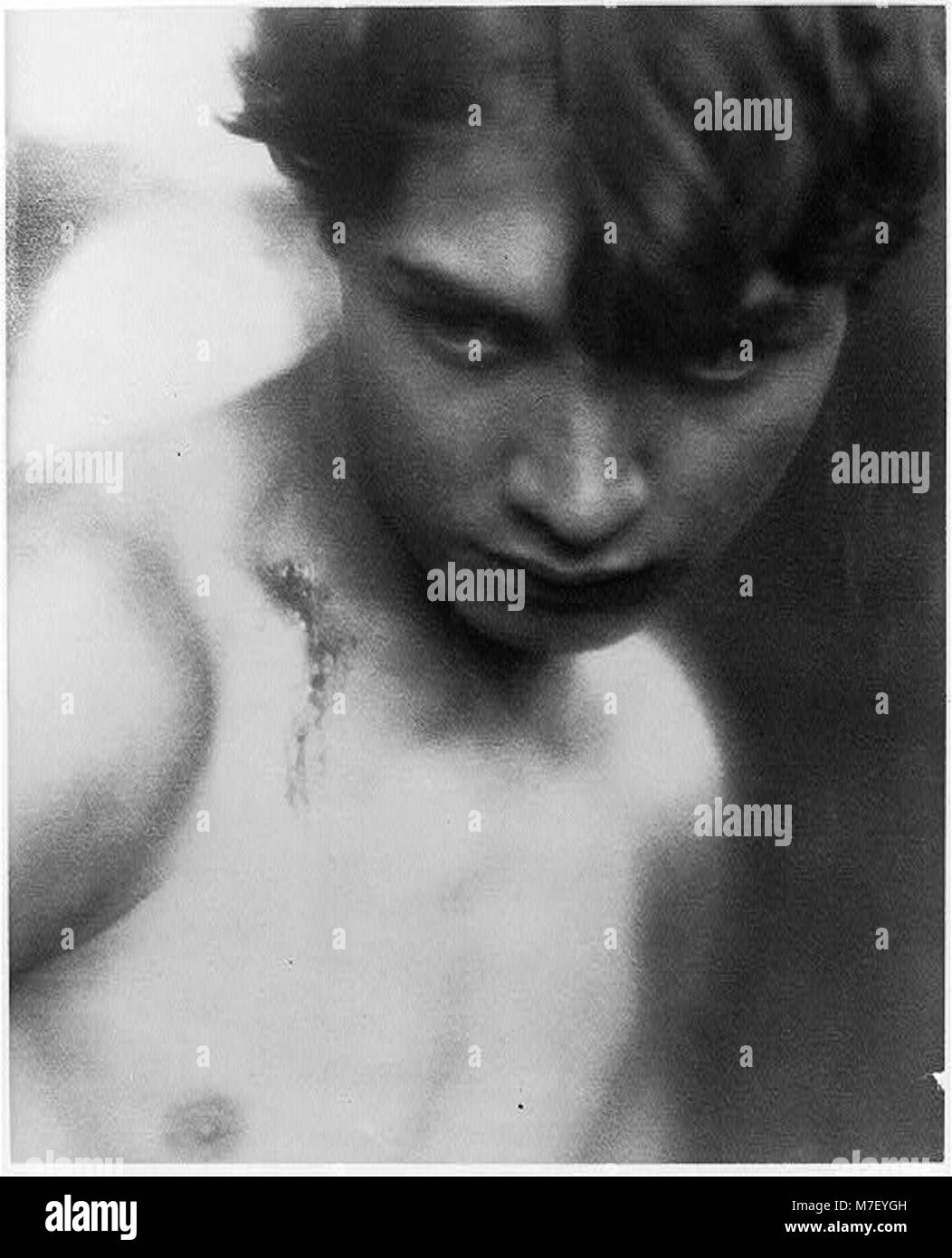 A classical painting of St. Sebastian, depicted with a wounded chest ...