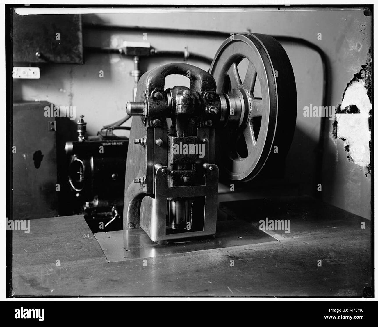 A photograph of a stamping machine at the U.S. Treasury, illustrating a ...