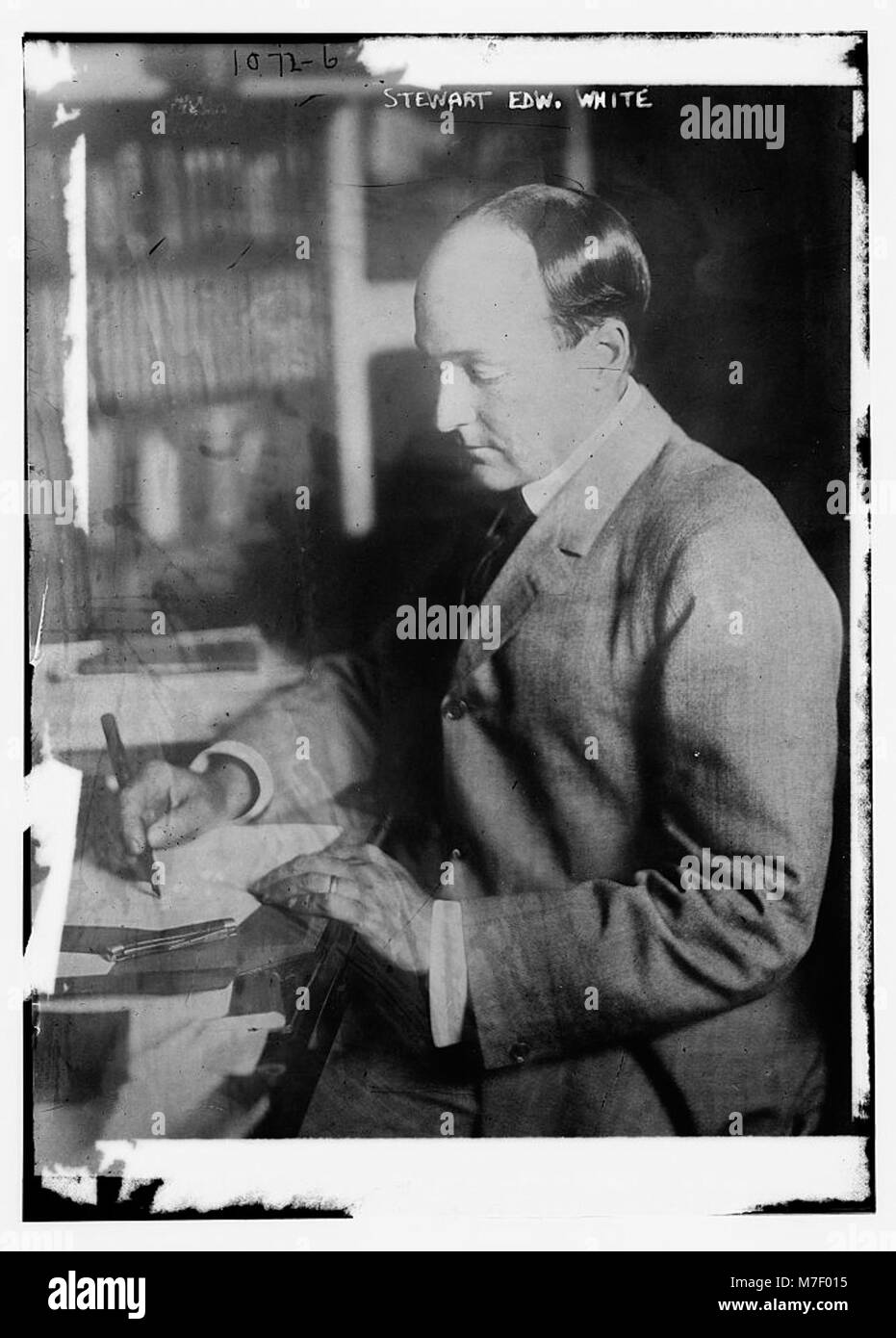 A photograph of Stewart Edw. White, a prominent American writer, seated ...