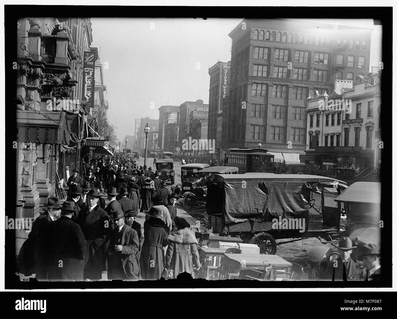 A historical street scene in Washington, D.C., capturing daily urban ...