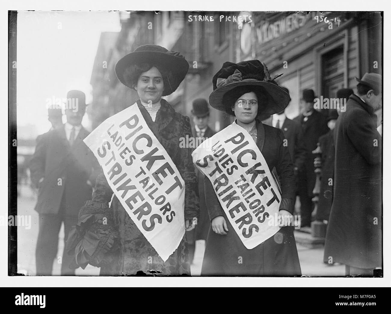 This photograph captures a striking picket line, a symbol of workers ...