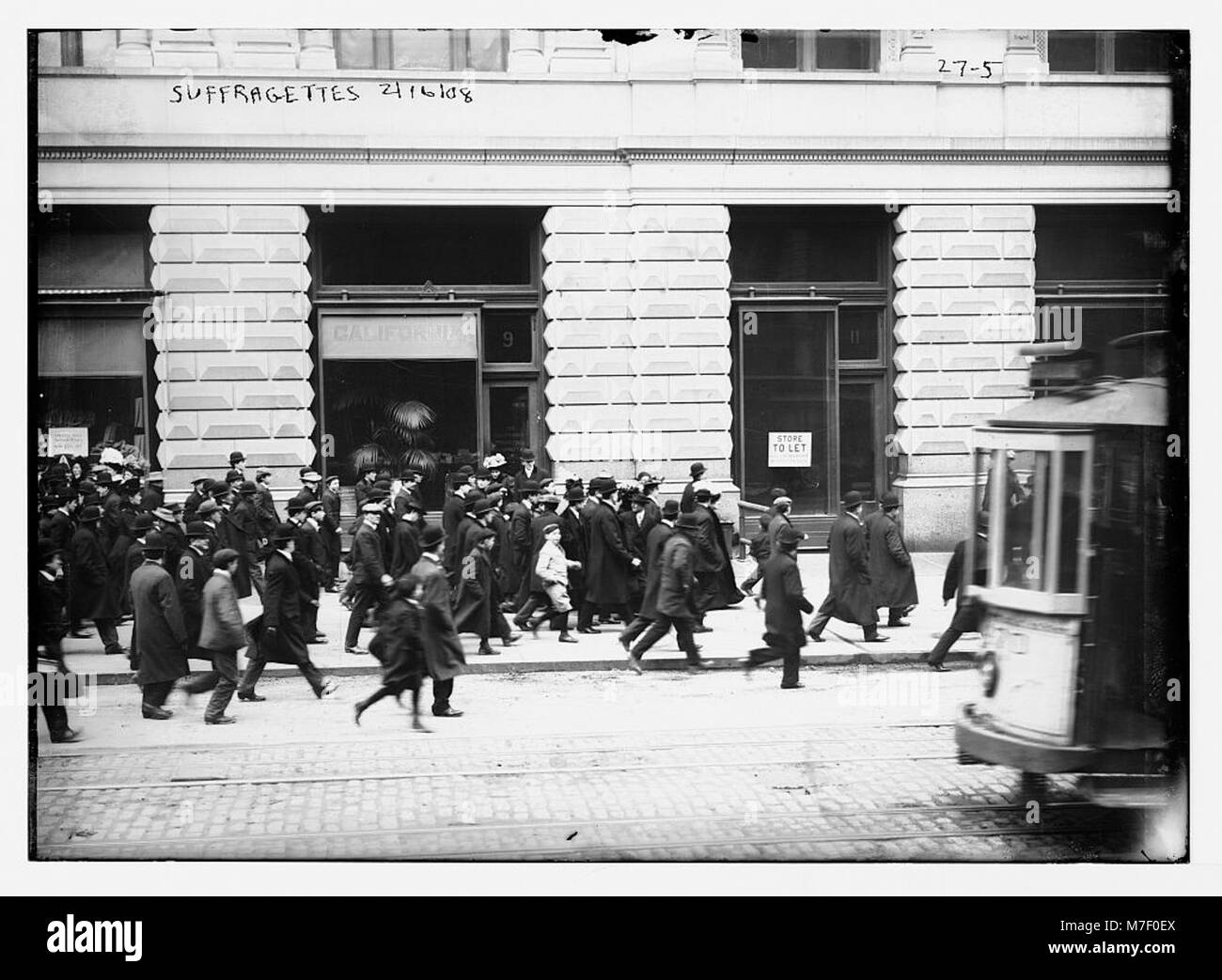 A historic photograph showing suffragettes in New York near train ...