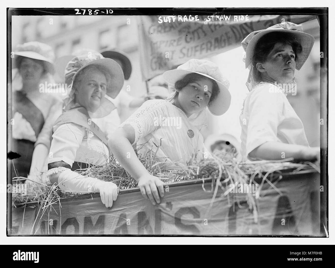 A photograph of women participating in a suffrage straw ride, a form of ...