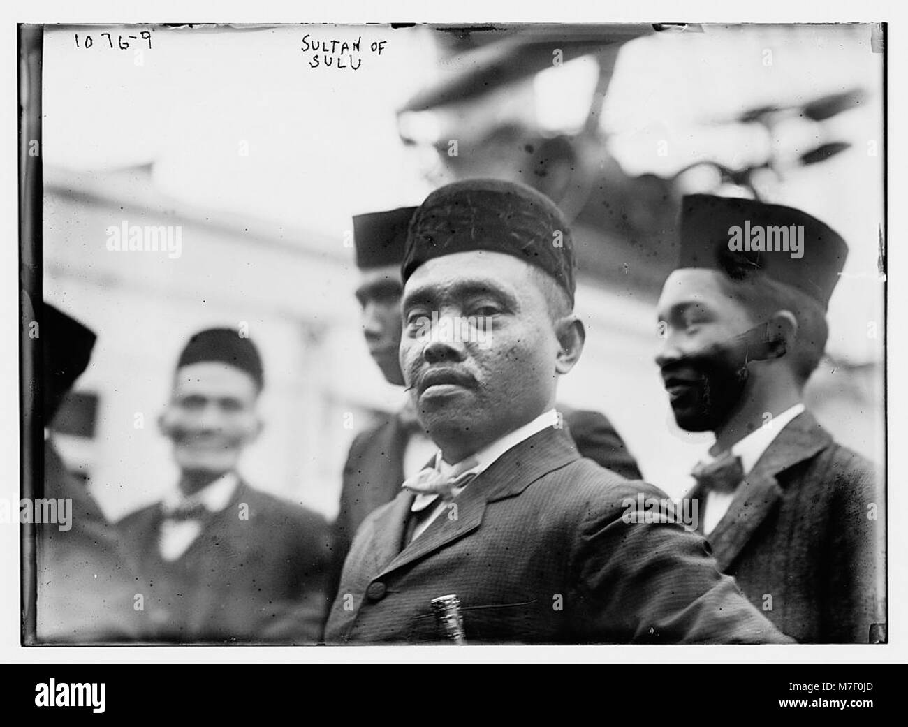 This photograph features the Sultan of Sulu with other figures, likely ...