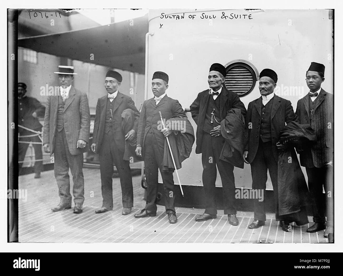The Sultan of Sulu with members of his suite aboard a ship, a ...