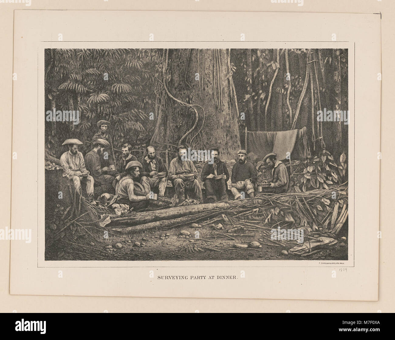 A historical photograph depicting a surveying party during dinner. The ...