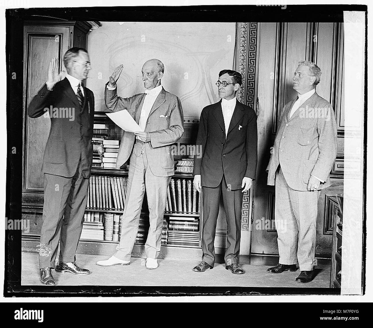 The photograph depicts the swearing-in ceremony of William R. Williams ...