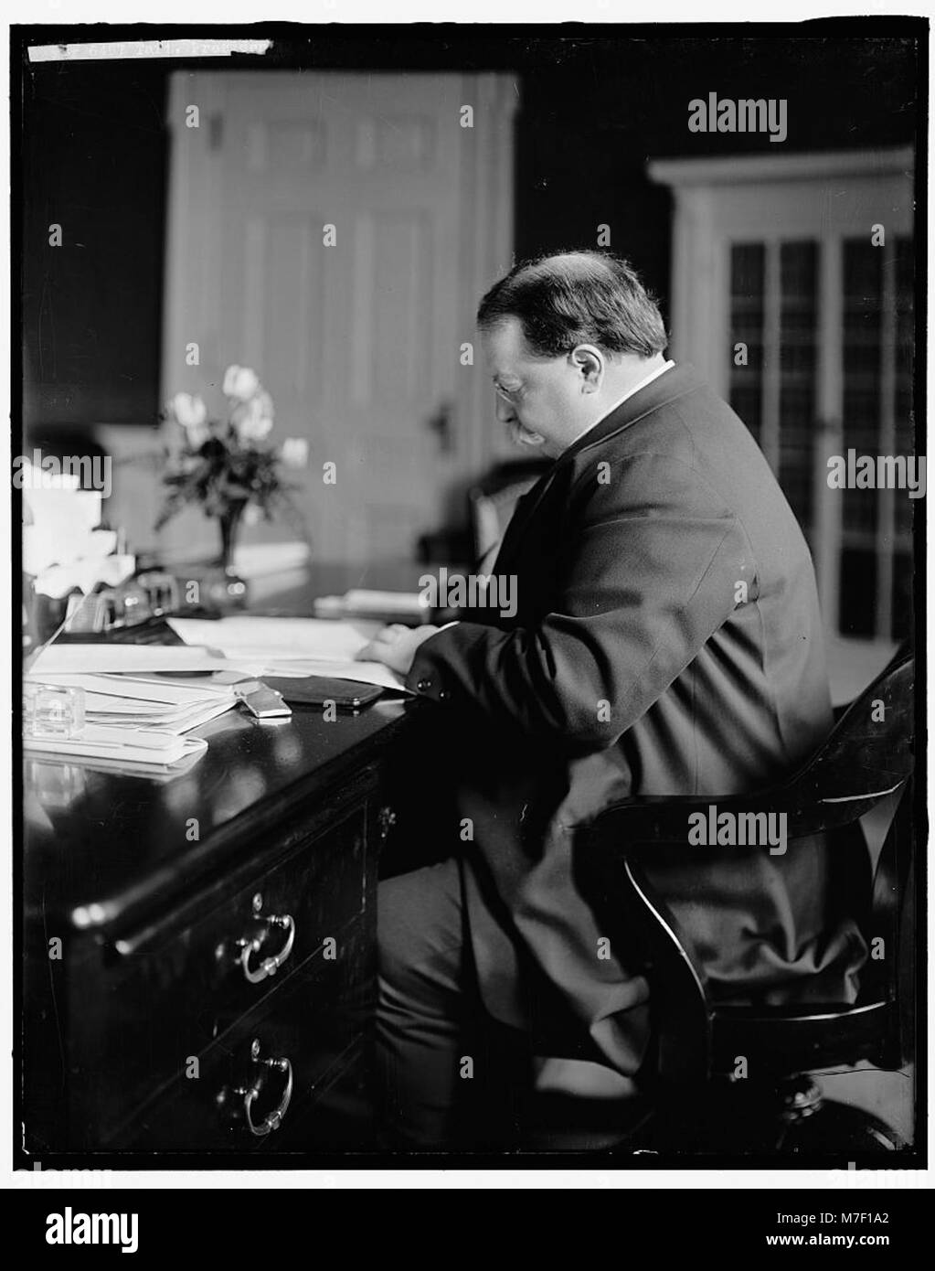 President William Howard Taft is pictured at his desk, capturing a ...
