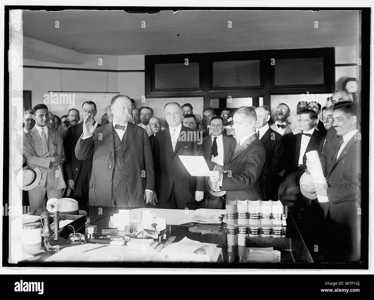 William H. Taft is shown taking the oath of office as Chief Justice of ...