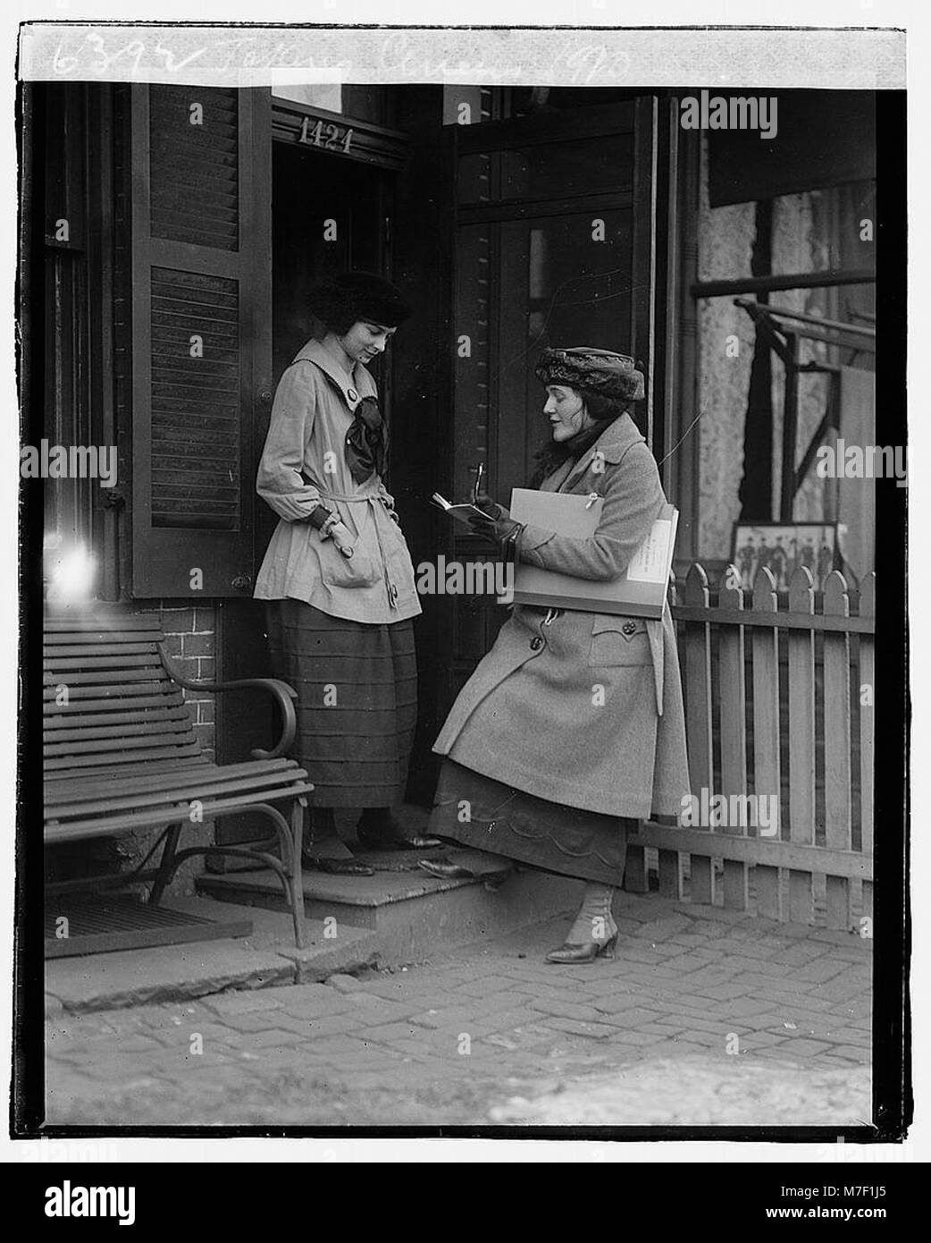 A historical photograph of U.S. Census workers collecting data during ...