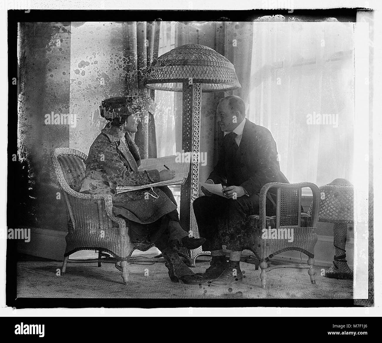 A historical image depicting the process of taking a census, likely ...