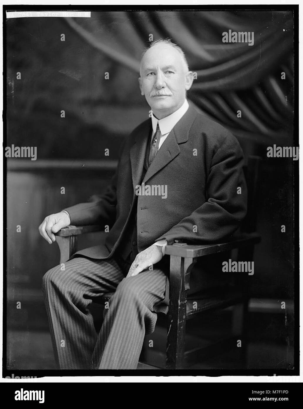 A portrait of G.W. Taylor, an honorable figure, captured in a ...