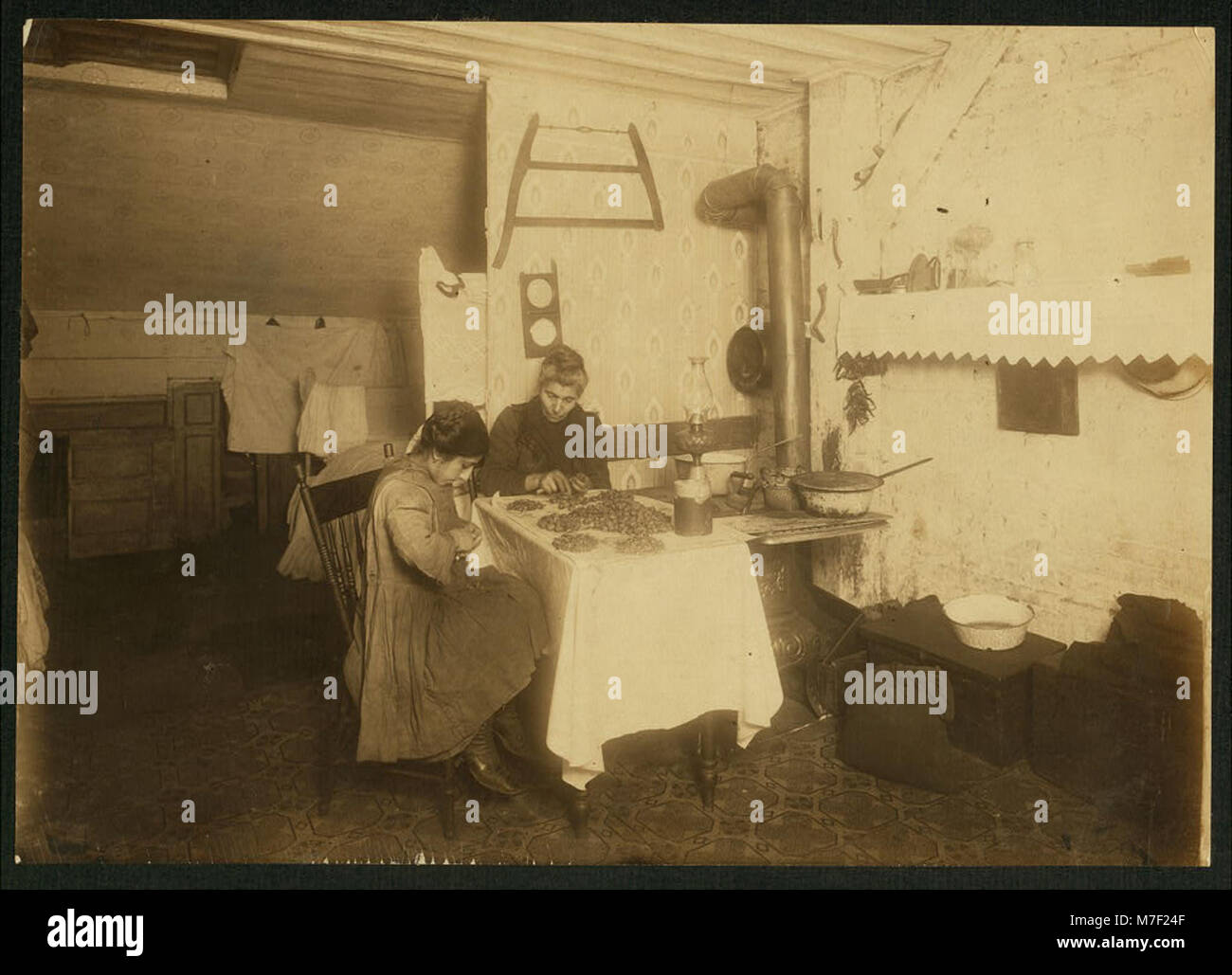 A photograph of 12-year-old Tessie Sposato and her mother working in ...