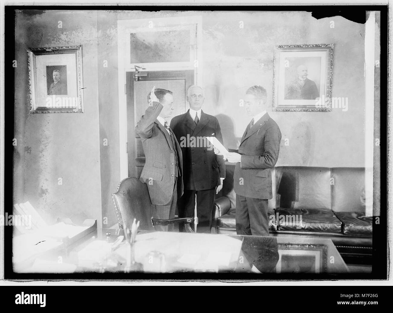 A photograph of Theodore Roosevelt taking the oath of office, marking his swearing-in as the ...