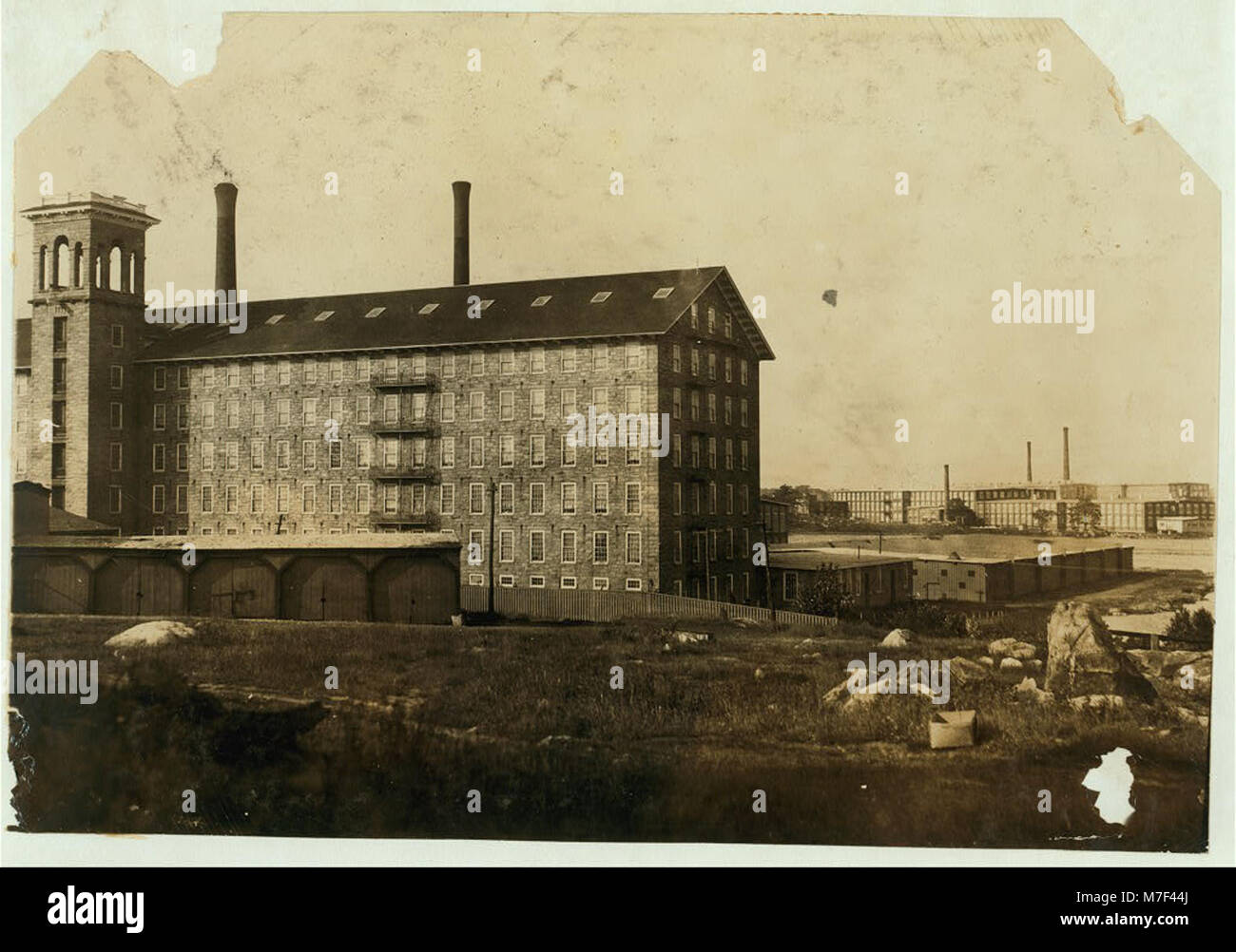 A historical photograph showing the juxtaposition of two mills: the ...