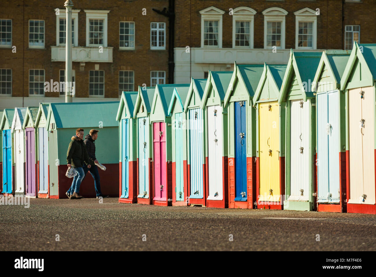 Colourful beach huts on Brighton seafront, East Sussex, England Stock ...