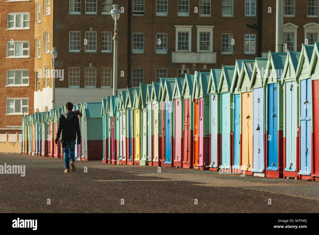 Colourful beach huts on Brighton seafront, East Sussex, England Stock ...