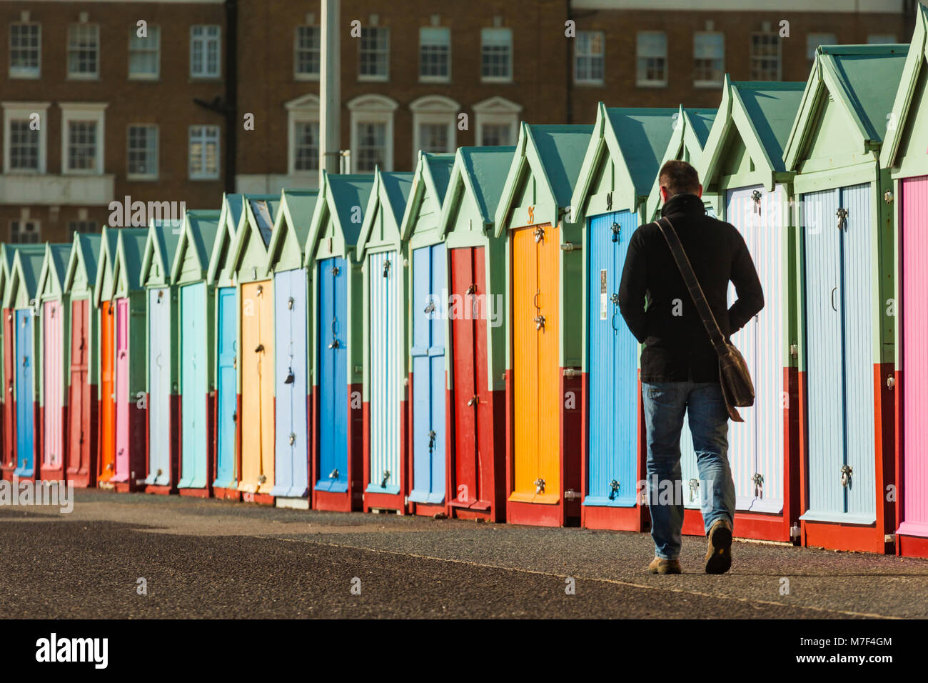 Colourful beach huts on Brighton seafront, East Sussex, England Stock ...