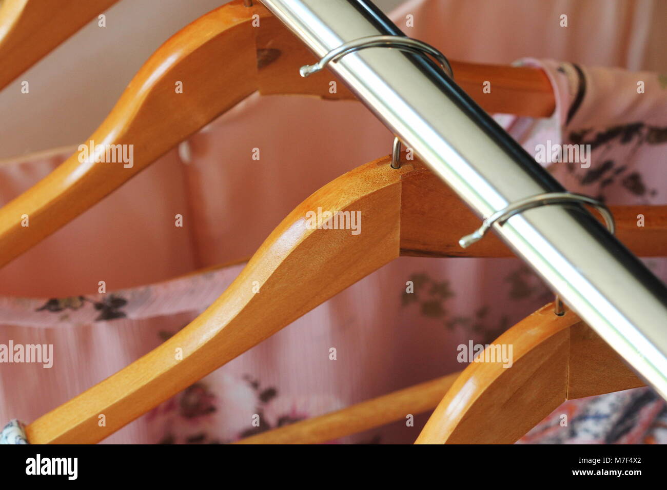 collection of women's clothes hanging on rack for sale Stock Photo - Alamy