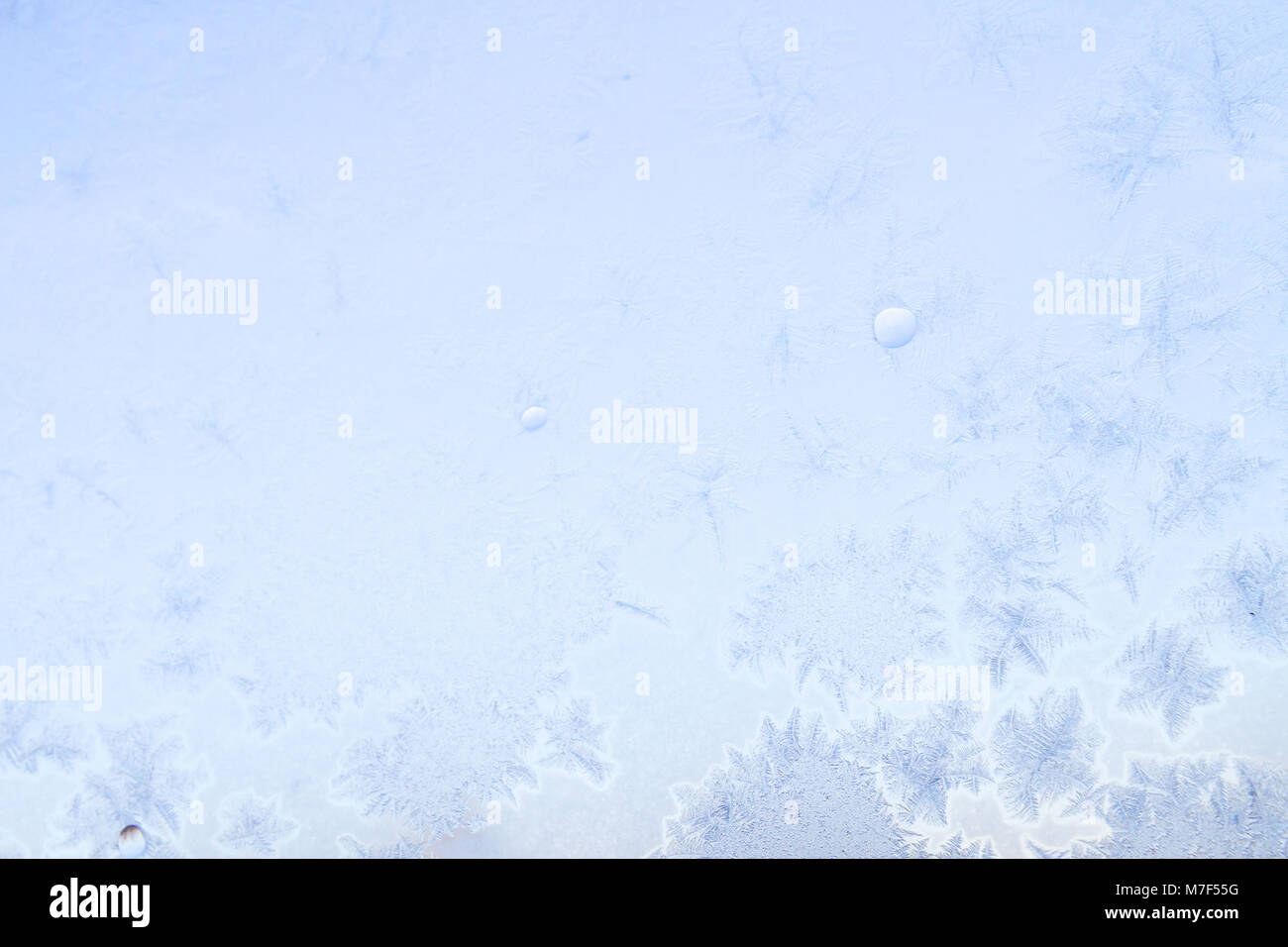 Winter frosty patterns on the frozen ice window Stock Photo - Alamy