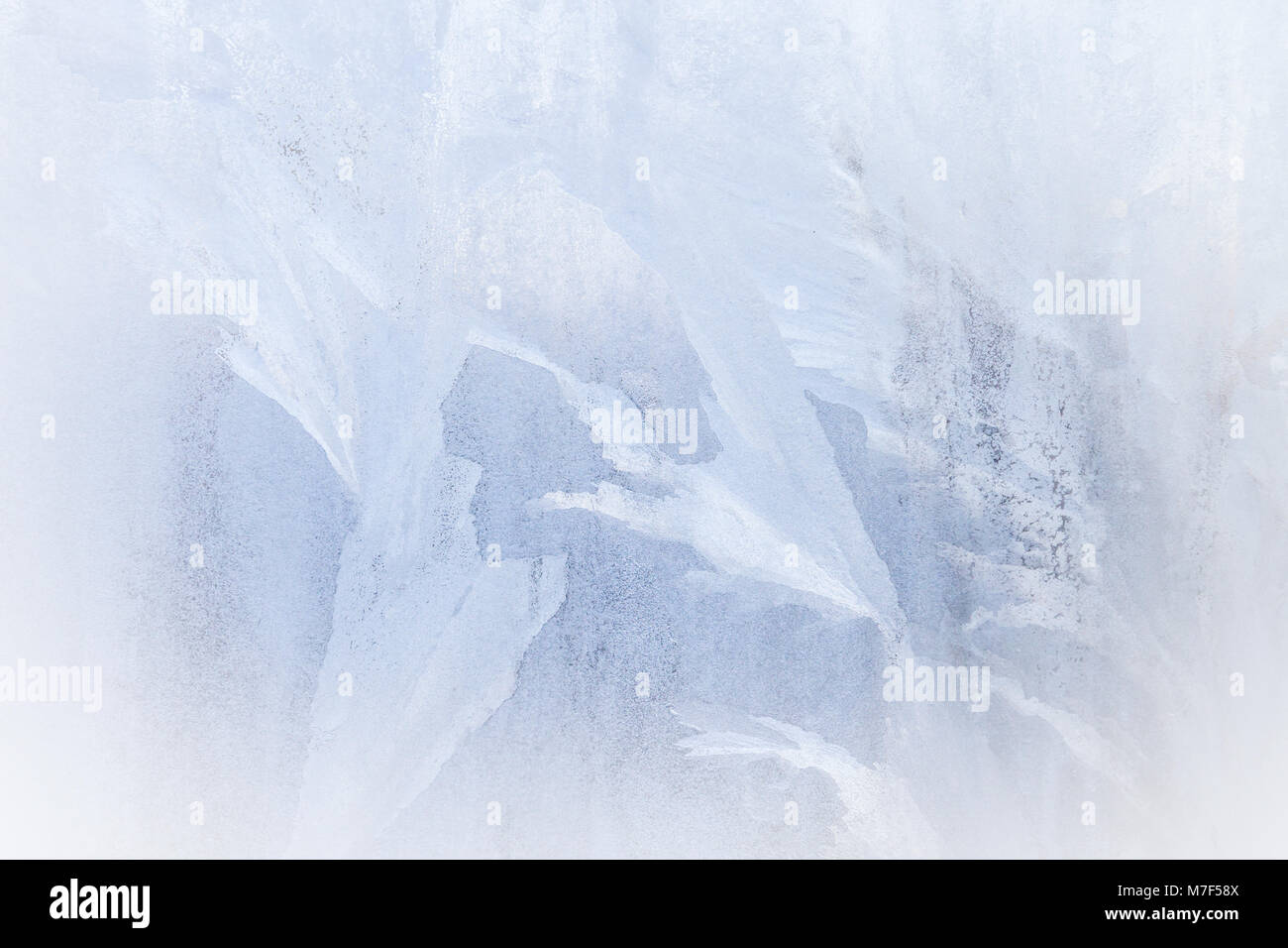 Winter frosty patterns on the frozen ice window Stock Photo - Alamy