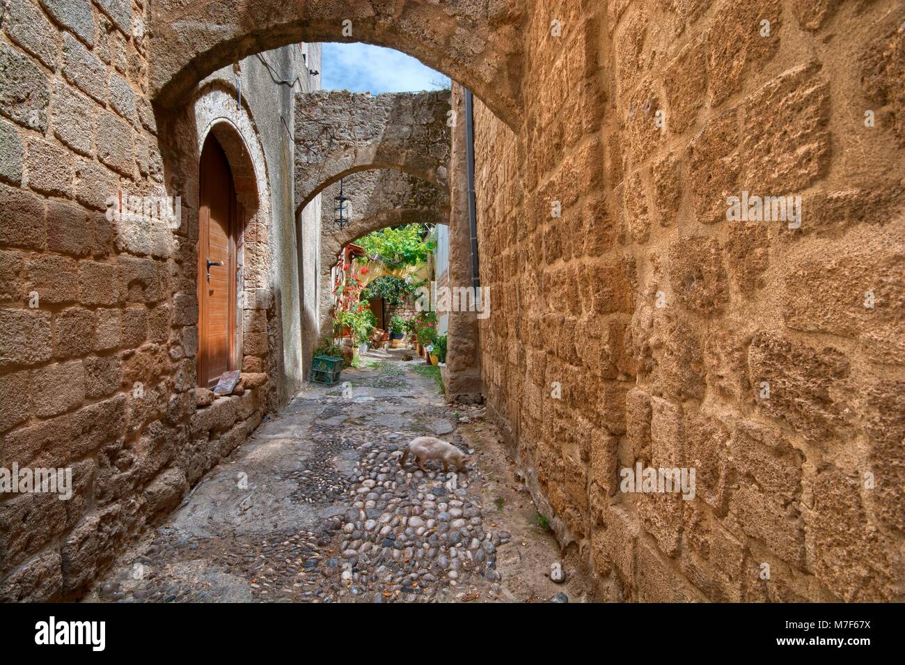 Narrow street of medieval Old Town of Rhodes - UNESCO World Heritage ...