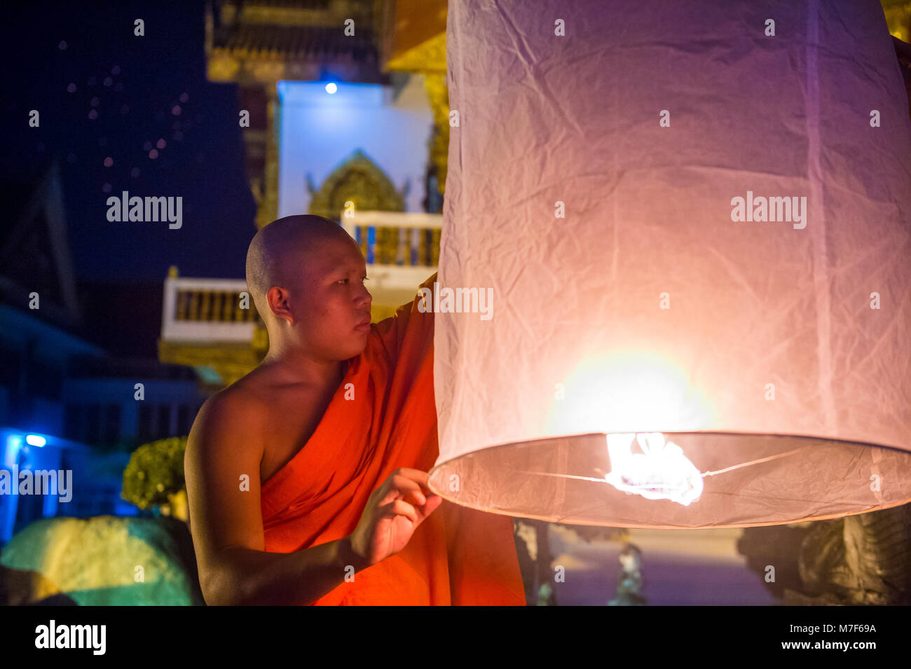Buddhist monk launch sky lantern during Yee Peng Stock Photo - Alamy