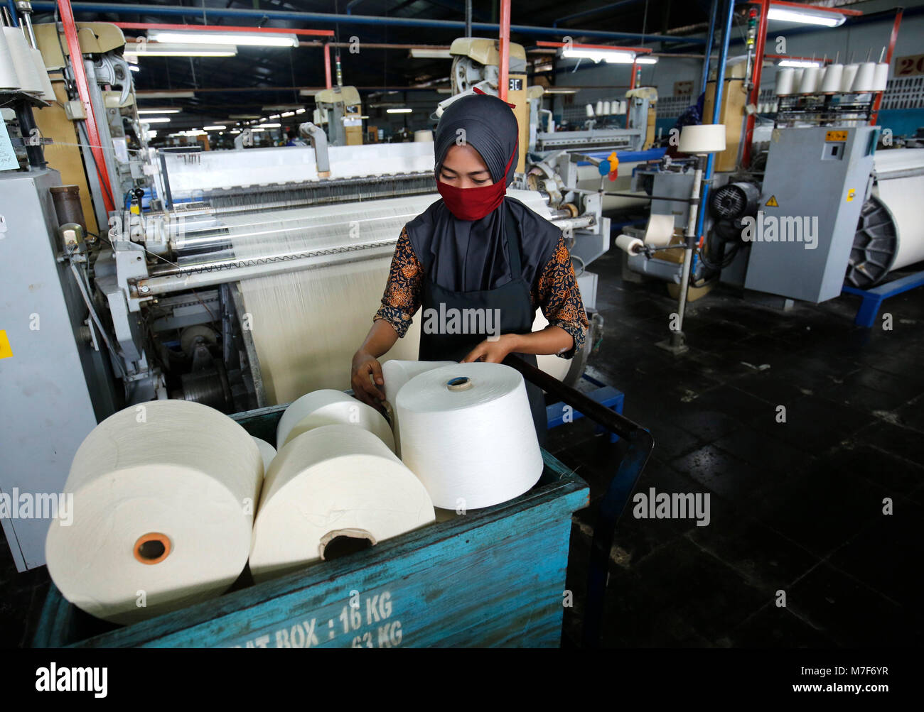 Pekalongan, Indonesia. 10th Mar, 2018. An Indonesia worker refilling a ...
