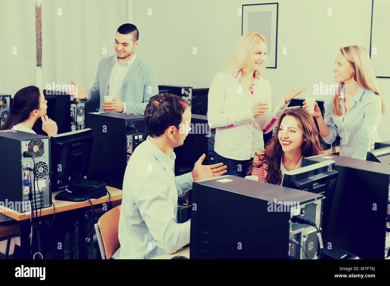 Happy employees positive manager celebrating hi-res stock photography ...