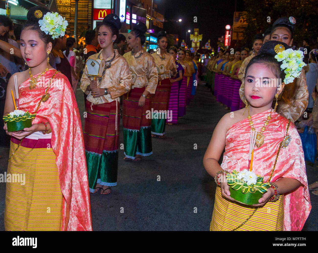 Participants in a parade during Yee Peng festival in Chiang Mai ...