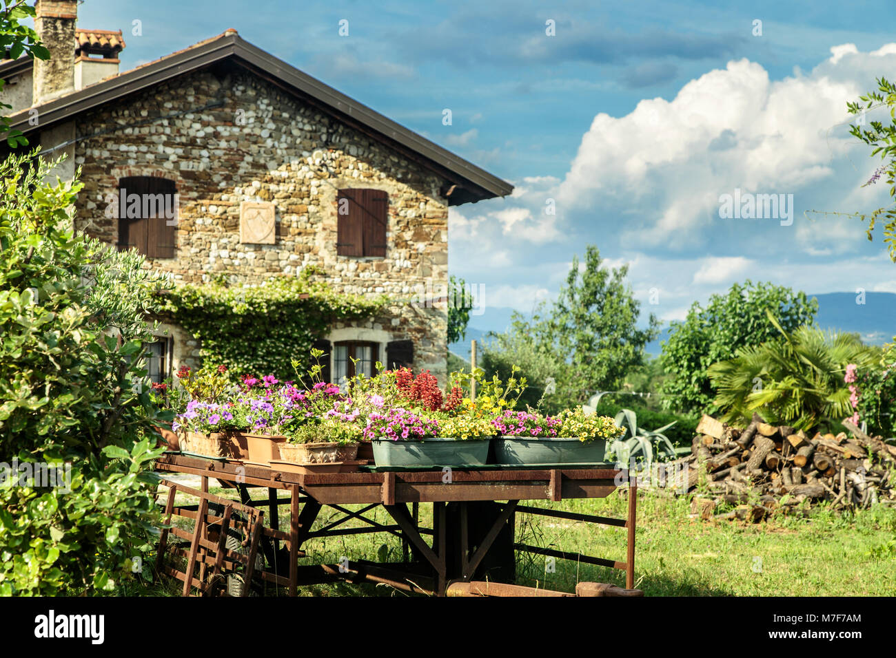 An old farm in the italian countryside with flowers in its garden Stock ...