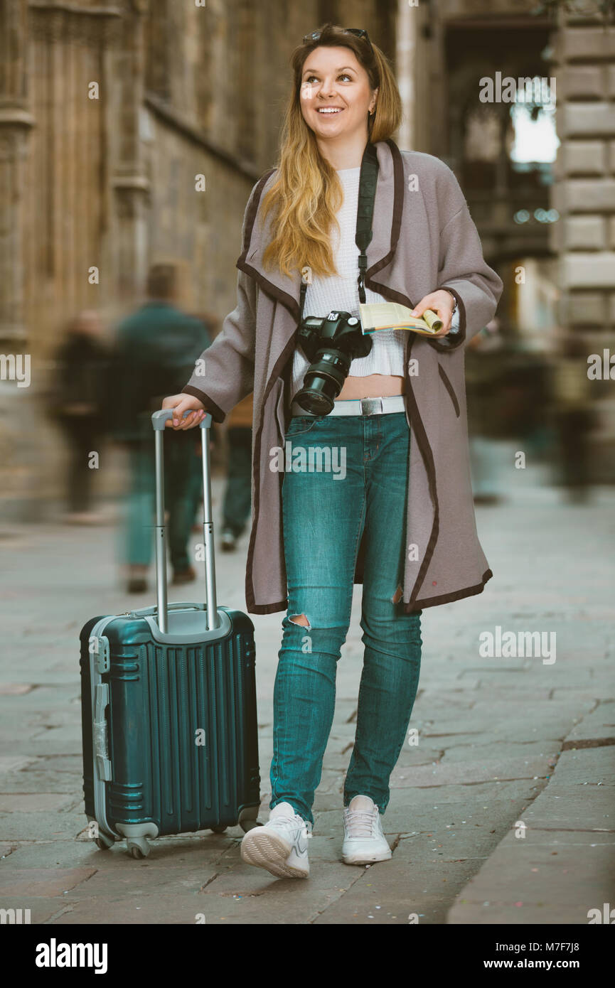 Positive and inquisitive young girl taking a journey in the city Stock Photo - Alamy