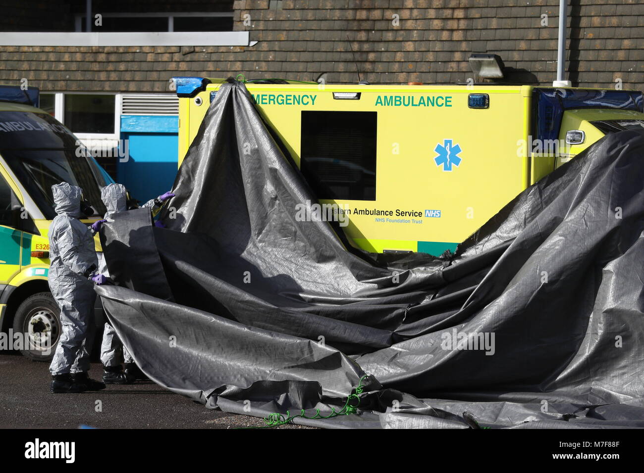 Investigators in gas masks examine an ambulance at the South Western ...