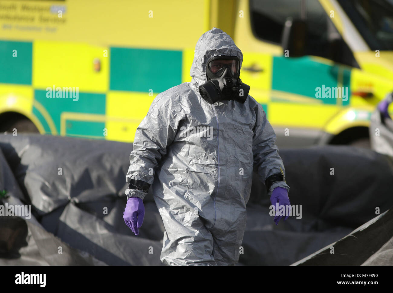 Investigators in gas masks examine an ambulance at the South Western ...