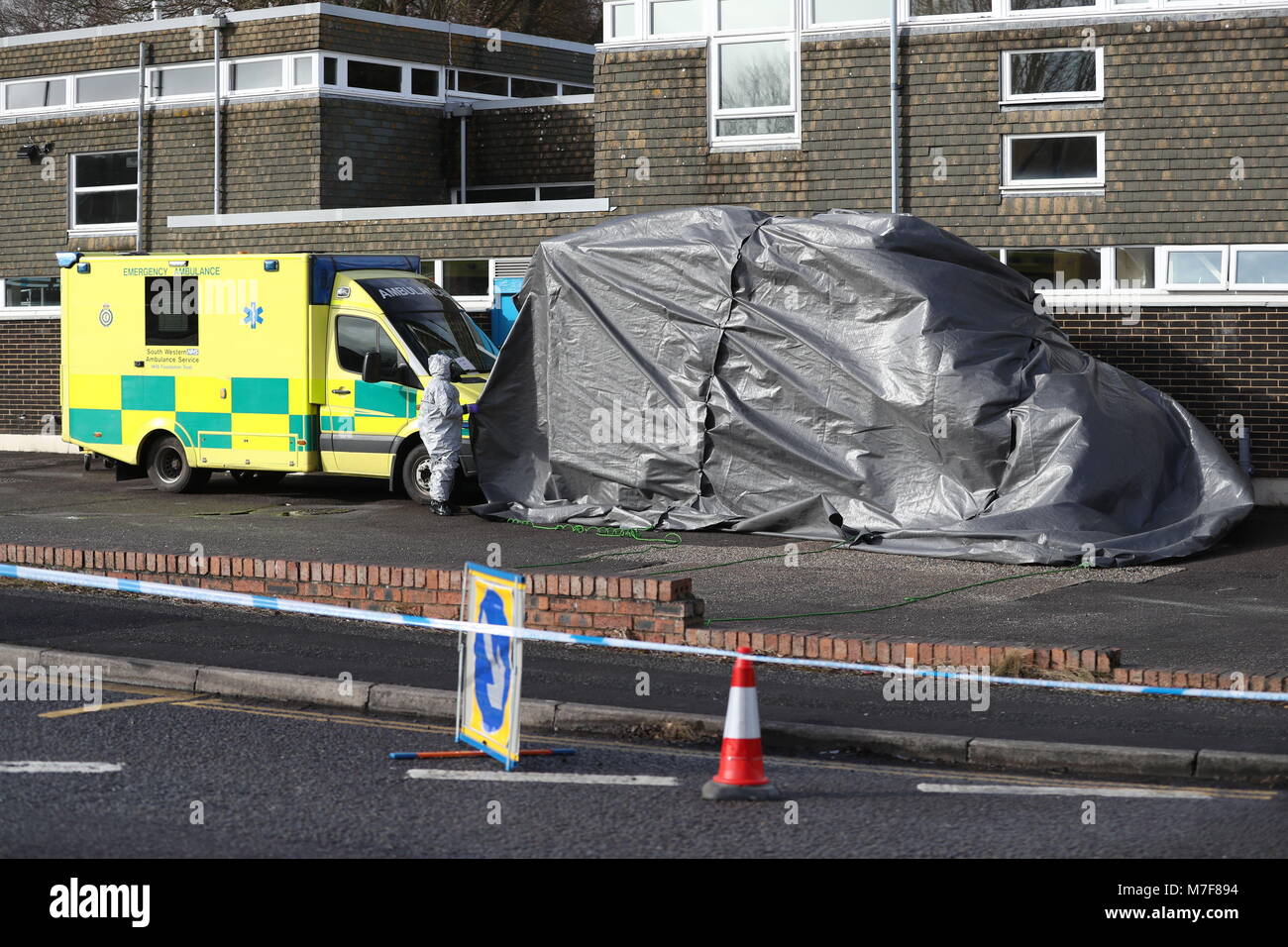 Investigators in gas masks examine an ambulance at the South Western ...
