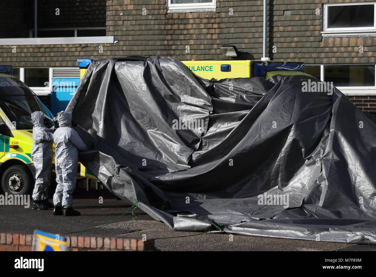Investigators in gas masks examine an ambulance at the South Western ...