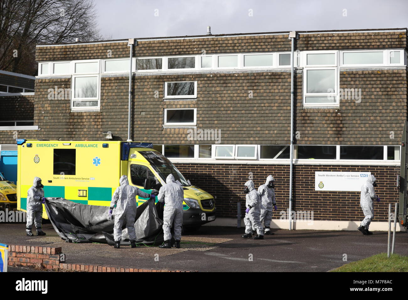 Investigators in gas masks examine an ambulance at the South Western ...