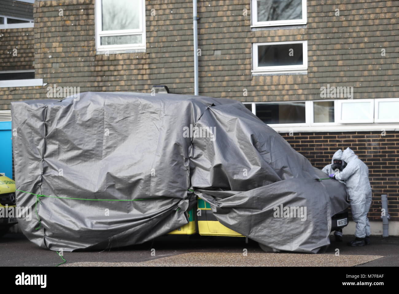 Investigators in gas masks examine an ambulance at the South Western ...