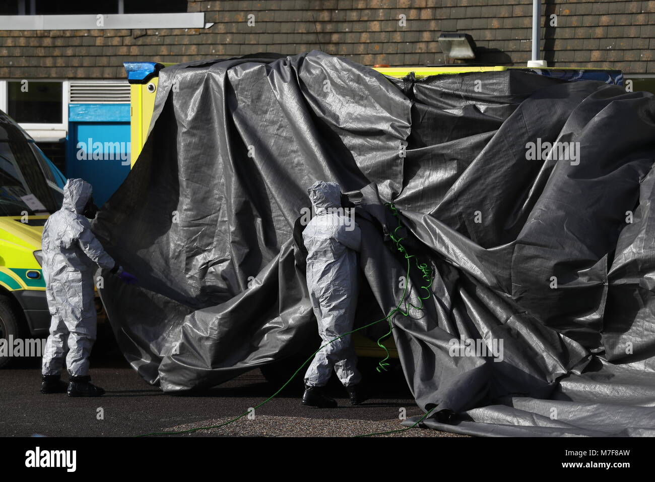 Investigators in gas masks examine an ambulance at the South Western ...