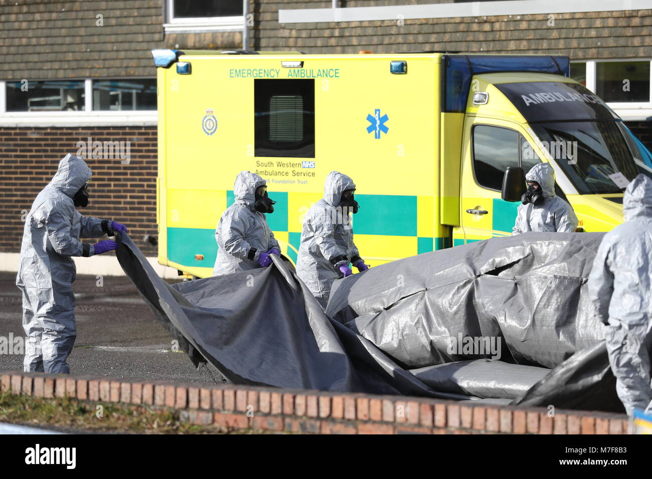 Investigators in gas masks examine an ambulance at the South Western ...