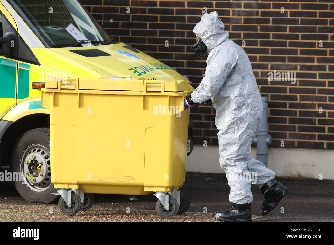 Investigators in gas masks examine an ambulance at the South Western ...