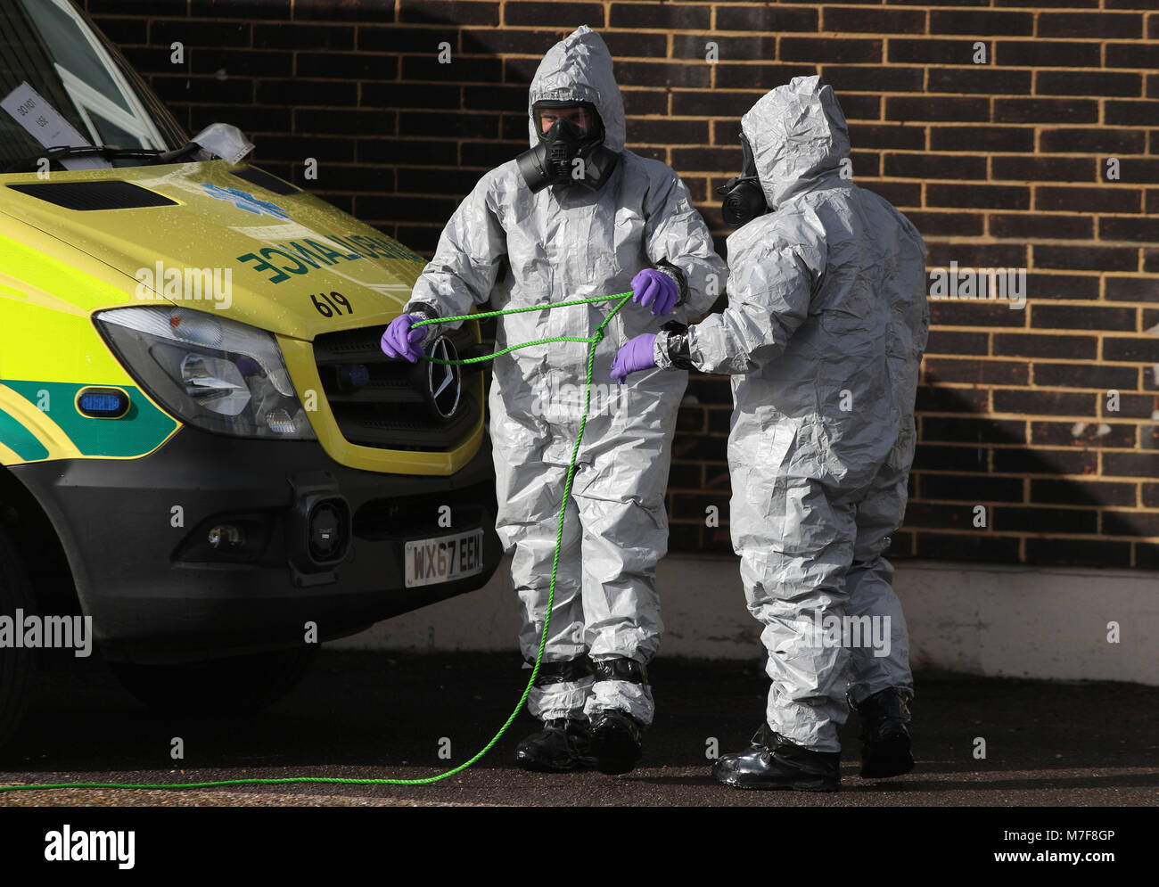 Investigators in gas masks examine an ambulance at the South Western ...