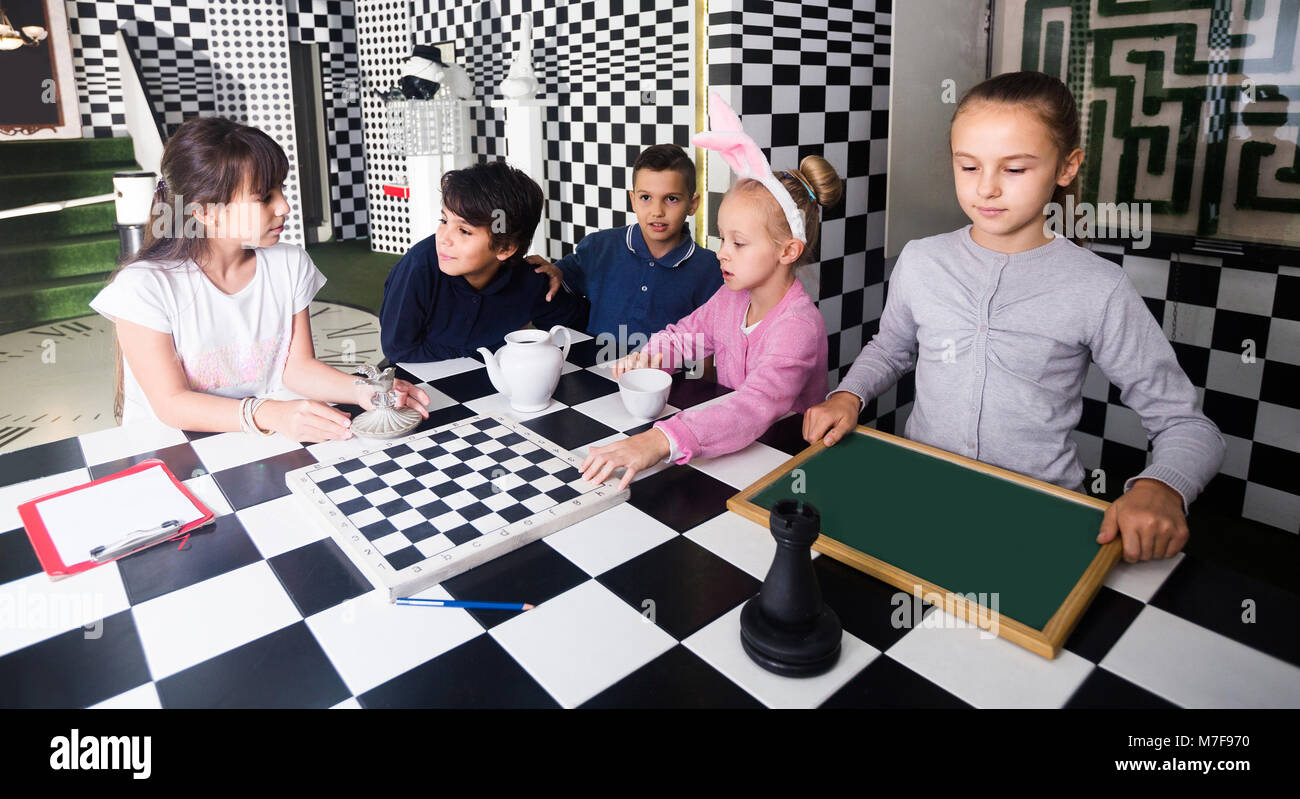 Enthusiastic french children play in the chess quest room Stock Photo ...