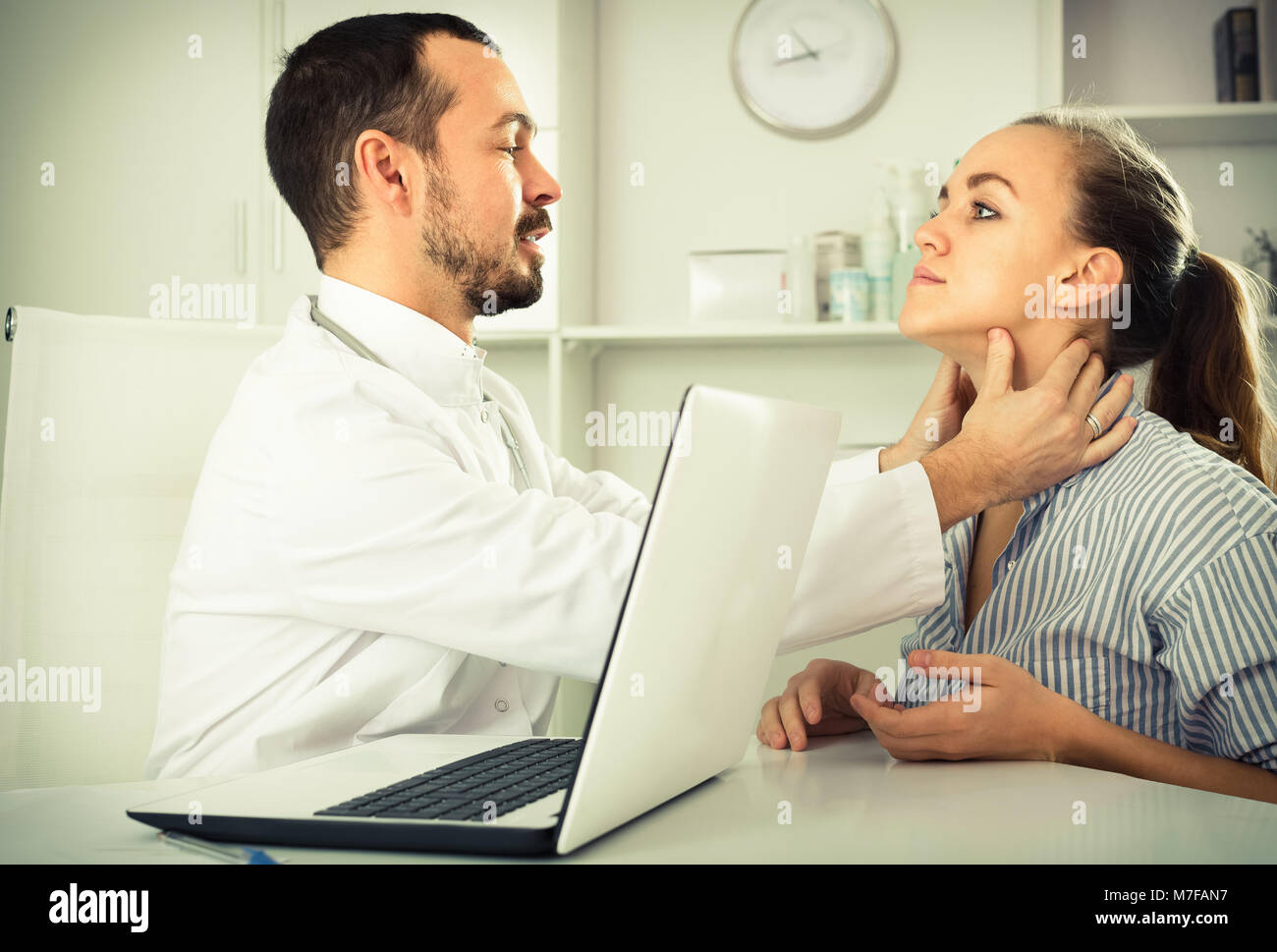 Young woman client visiting consultation with man doctor in hospital ...