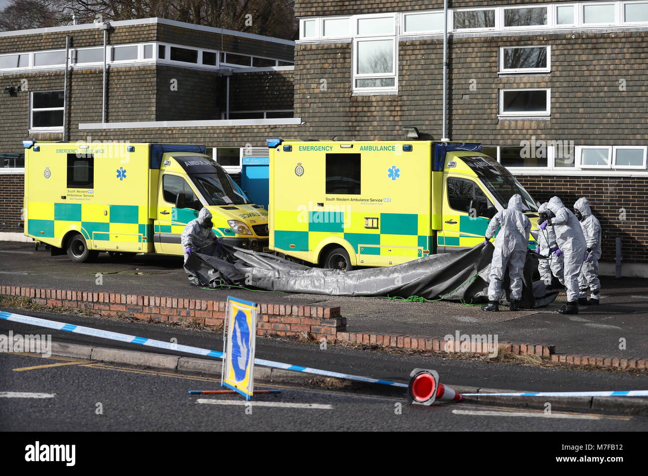 Investigators in gas masks examine an ambulance at the South Western ...
